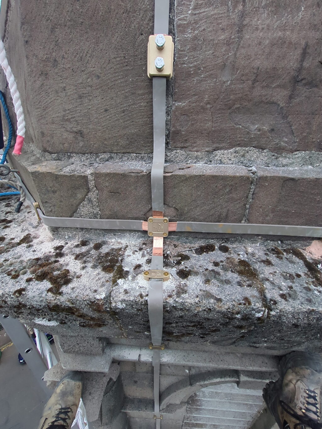 New copper lightning conductor tape installed on a church spire – BCM ...